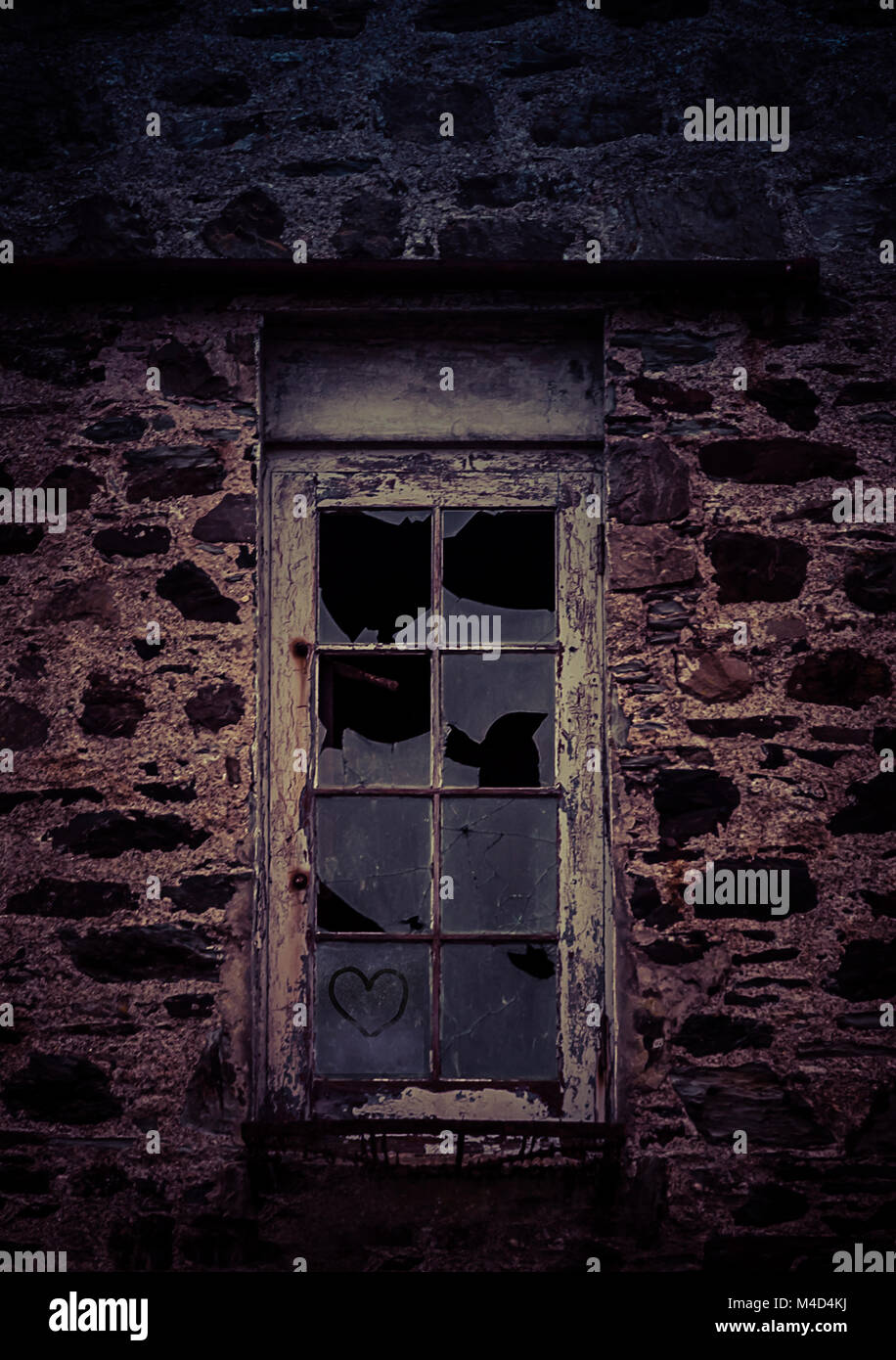 derelict and smashed window with heart drawn on one pane Stock Photo ...