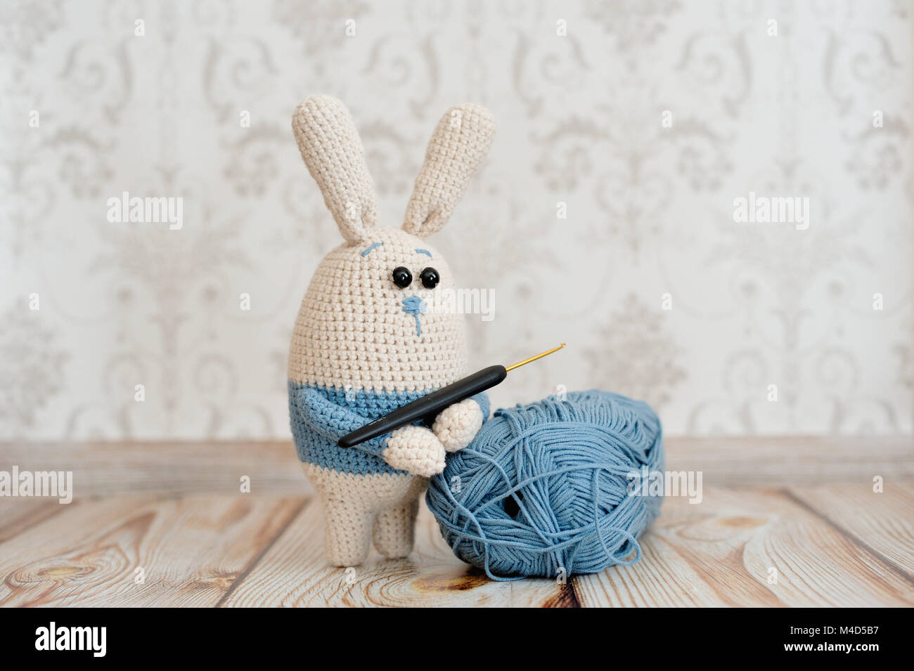 Rabbit toy knitted in the technique of knitting amigurumi Stock Photo ...
