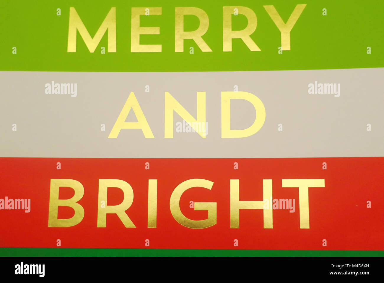 A christmas illustration of 'be merry' in red and gold Stock Photo - Alamy