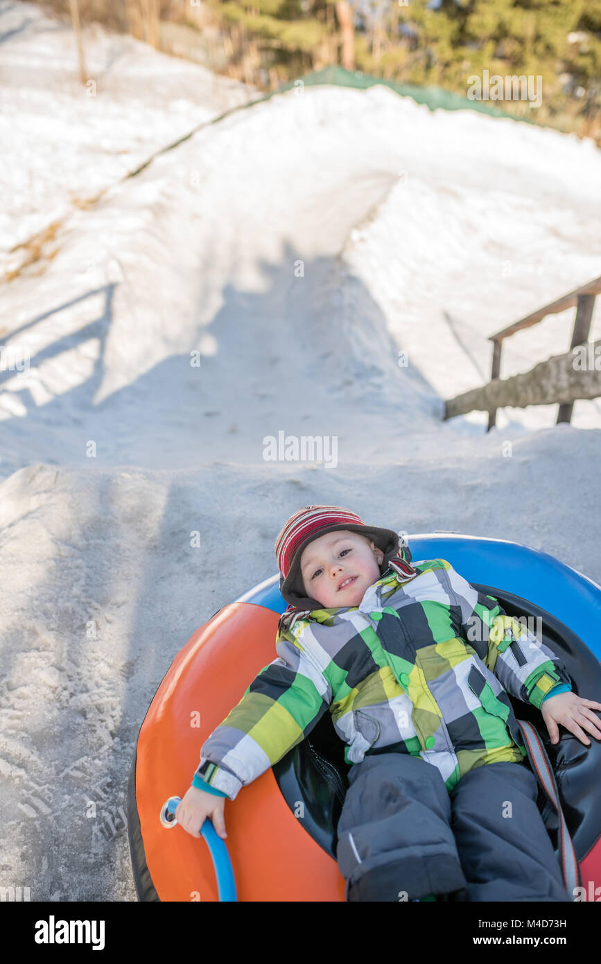 Ready to slide in snow Stock Photo - Alamy