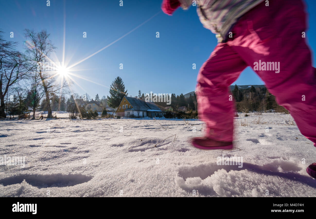 Running in the snow Stock Photo - Alamy
