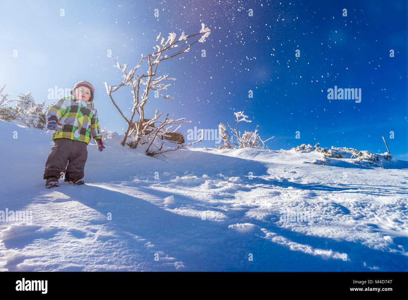 Boy in the snow Stock Photo - Alamy