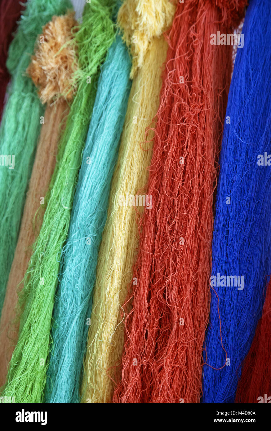 Multicolored thread background Stock Photo - Alamy