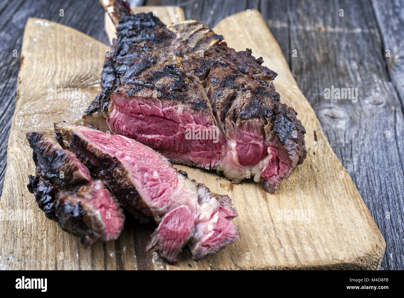 Barbecue Tomahawk Steak on Cutting Board Stock Photo - Alamy