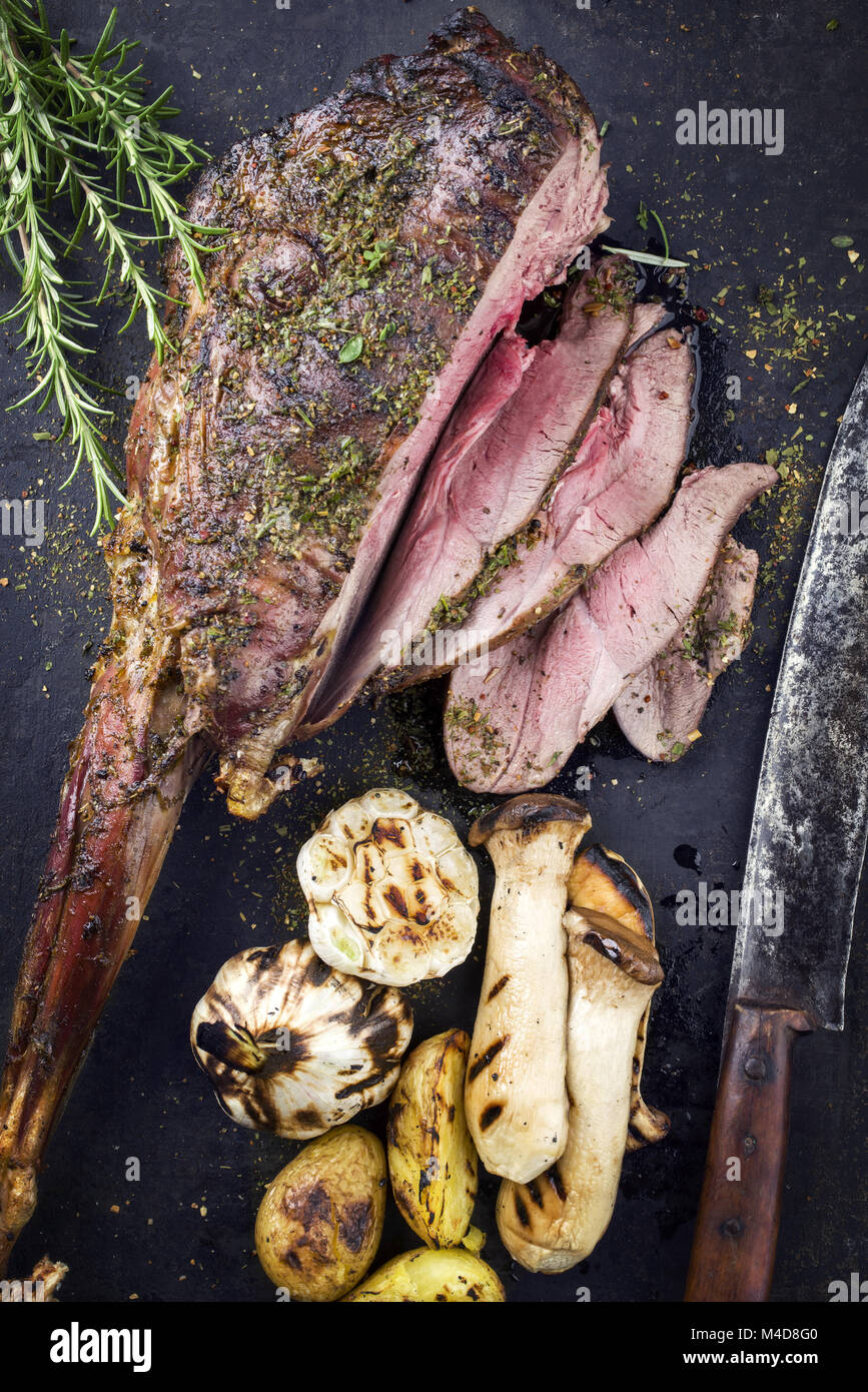 Barbecue Haunch of Venison on old Metal Sheet Stock Photo - Alamy