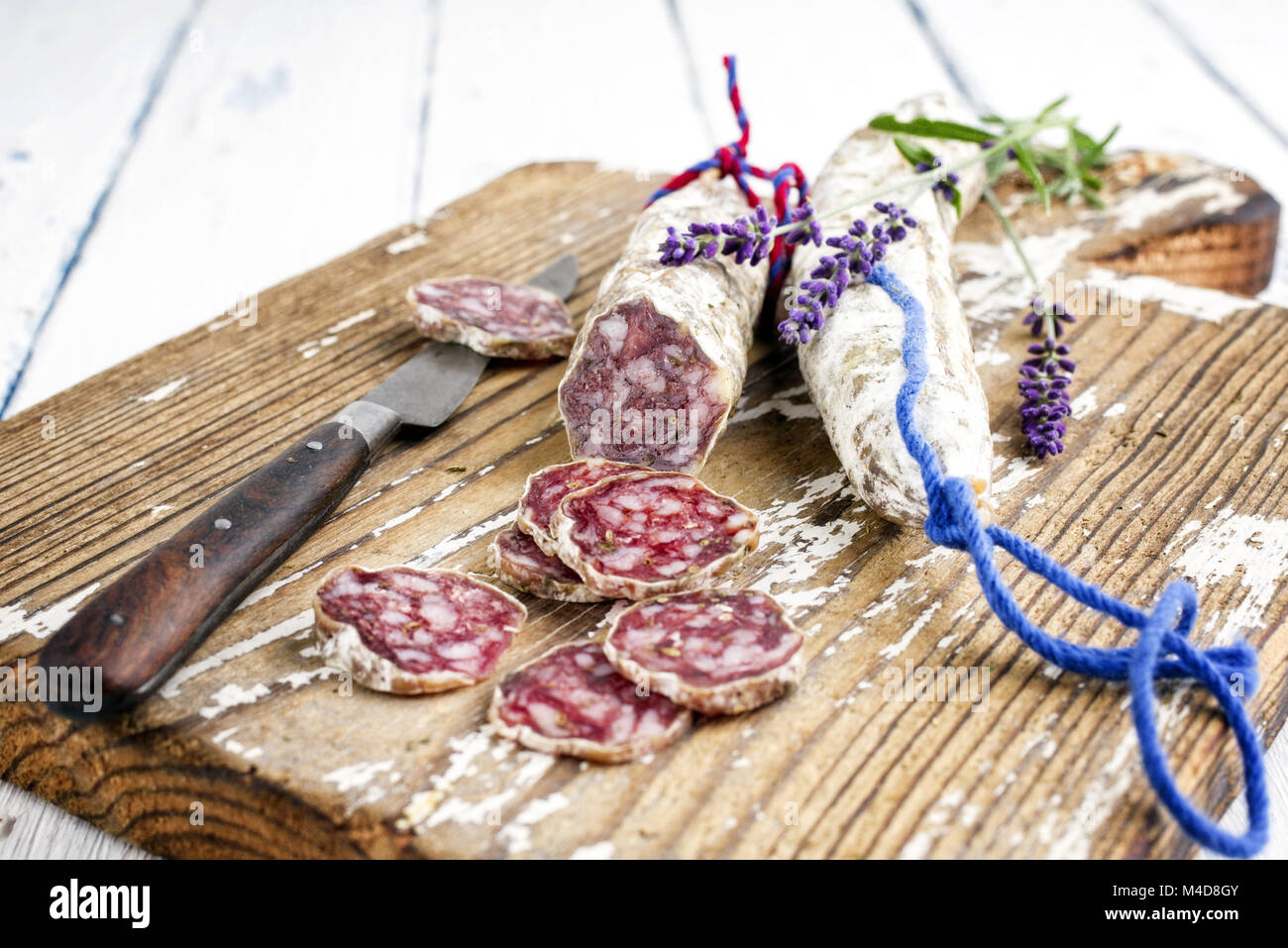 Cutting salami hi-res stock photography and images - Alamy
