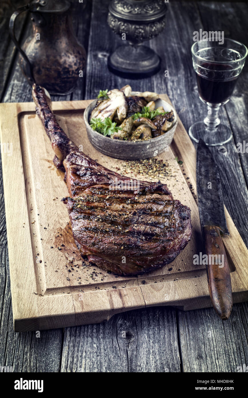 Barbecue Tomahawk Steak on Cutting Board Stock Photo - Alamy