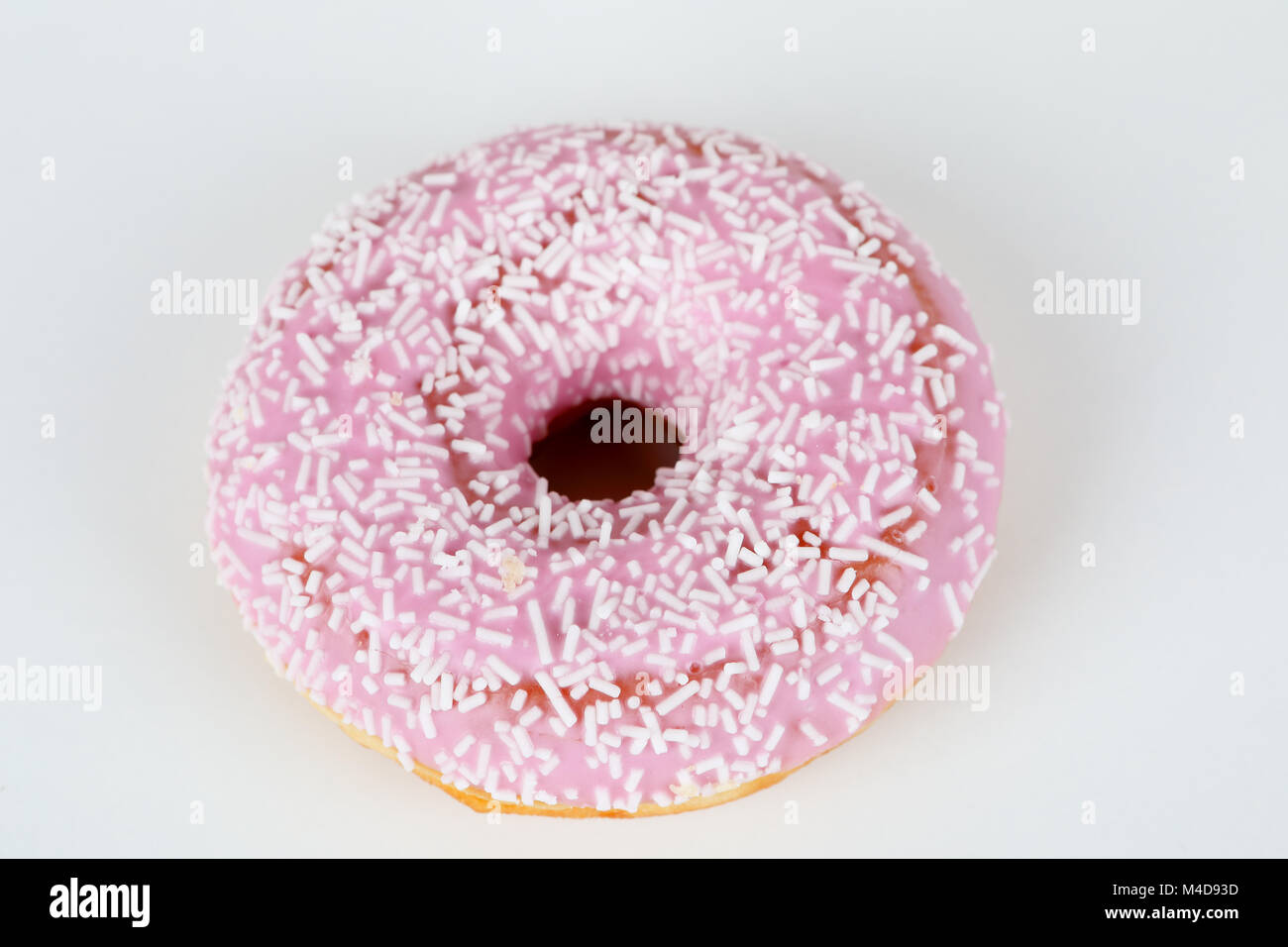 pink donut with sprinkles Stock Photo - Alamy