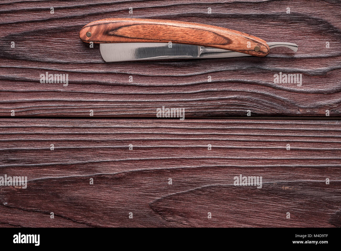 Vintage barber shop straight razor tool on wooden background Stock ...