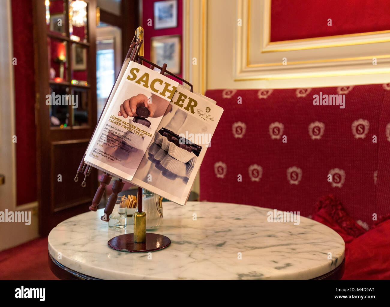 Pamphlet on a table in the famous Cafe Sacher, in Vienna Austria Stock ...