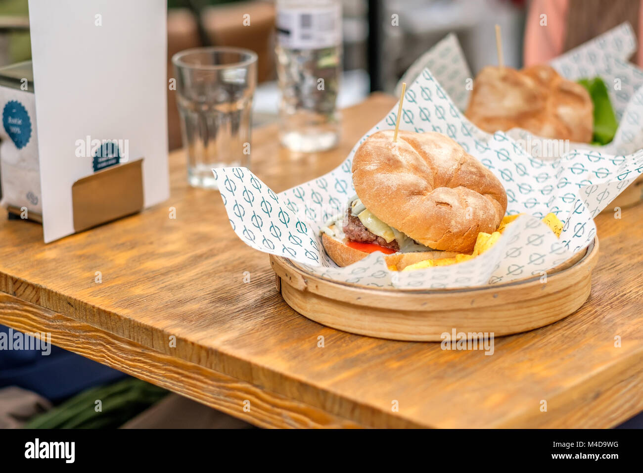 Cheeseburger in outdoor restaurant Stock Photo - Alamy