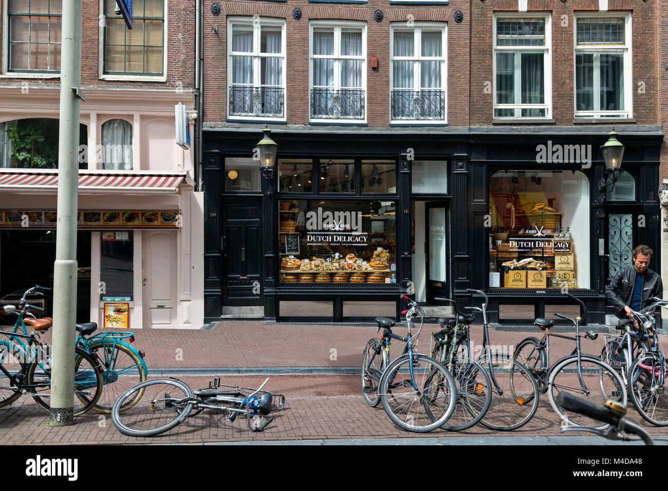 Storefront of bakery with apartments above on a city street in ...