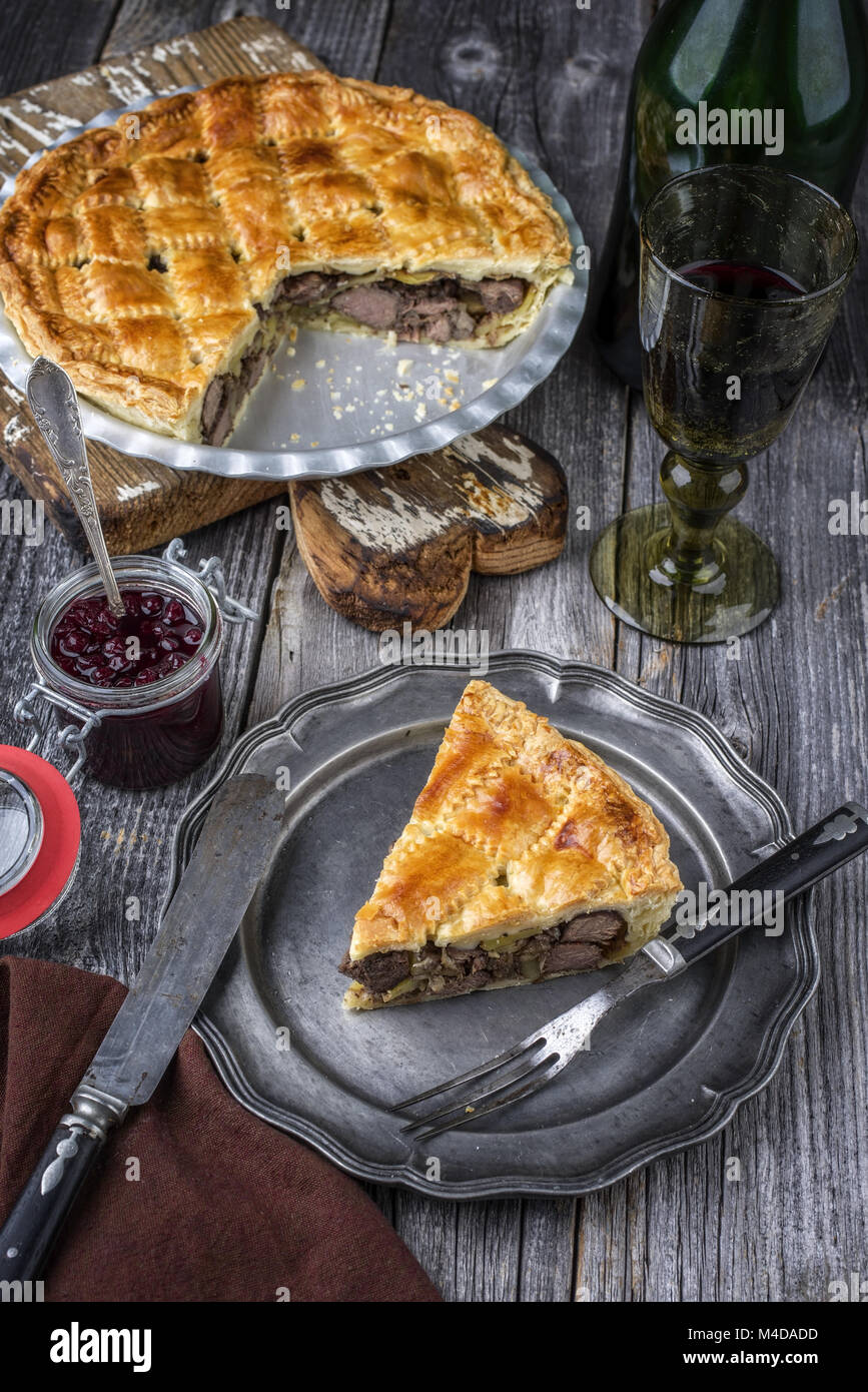 Vanison Pie with Cranberry as close-up on a plate Stock Photo - Alamy