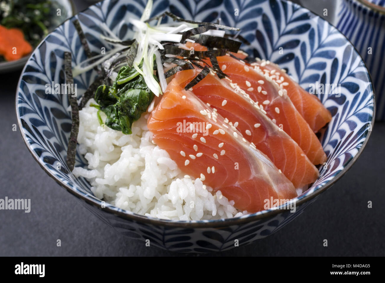 Salmon Sashimi with Rice and Vegetable Stock Photo - Alamy