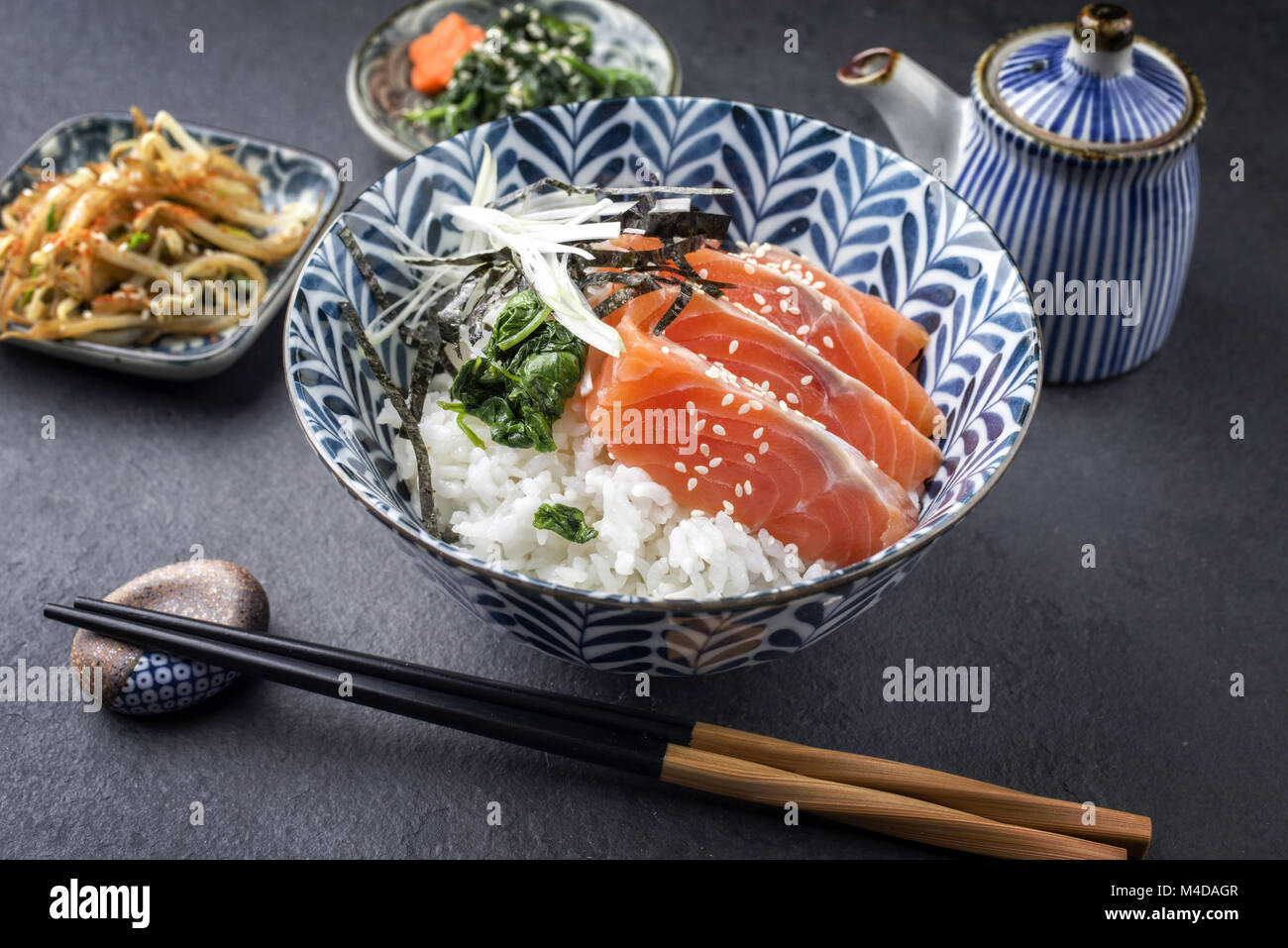Salmon Sashimi with Rice and Vegetable Stock Photo - Alamy