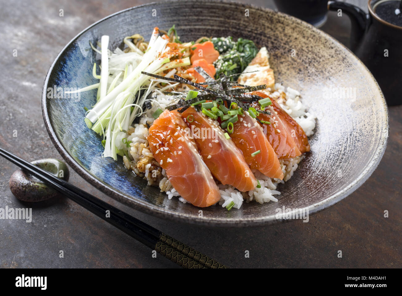 Salmon Sashimi with Rice and Vegetable Stock Photo - Alamy