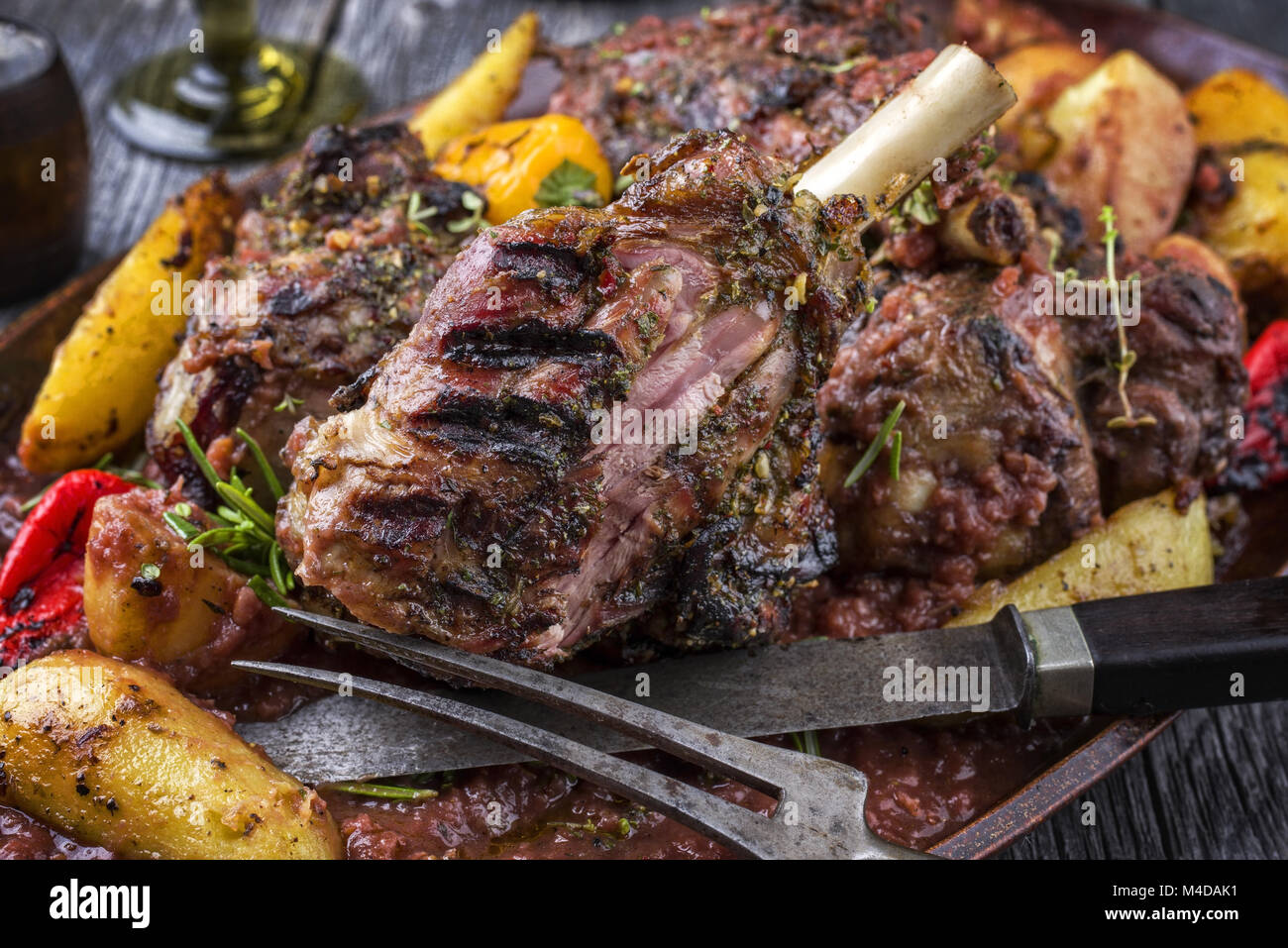 Lamb Knuckles with Fried Potatoes in Burgundy Sauce on Plate Stock ...