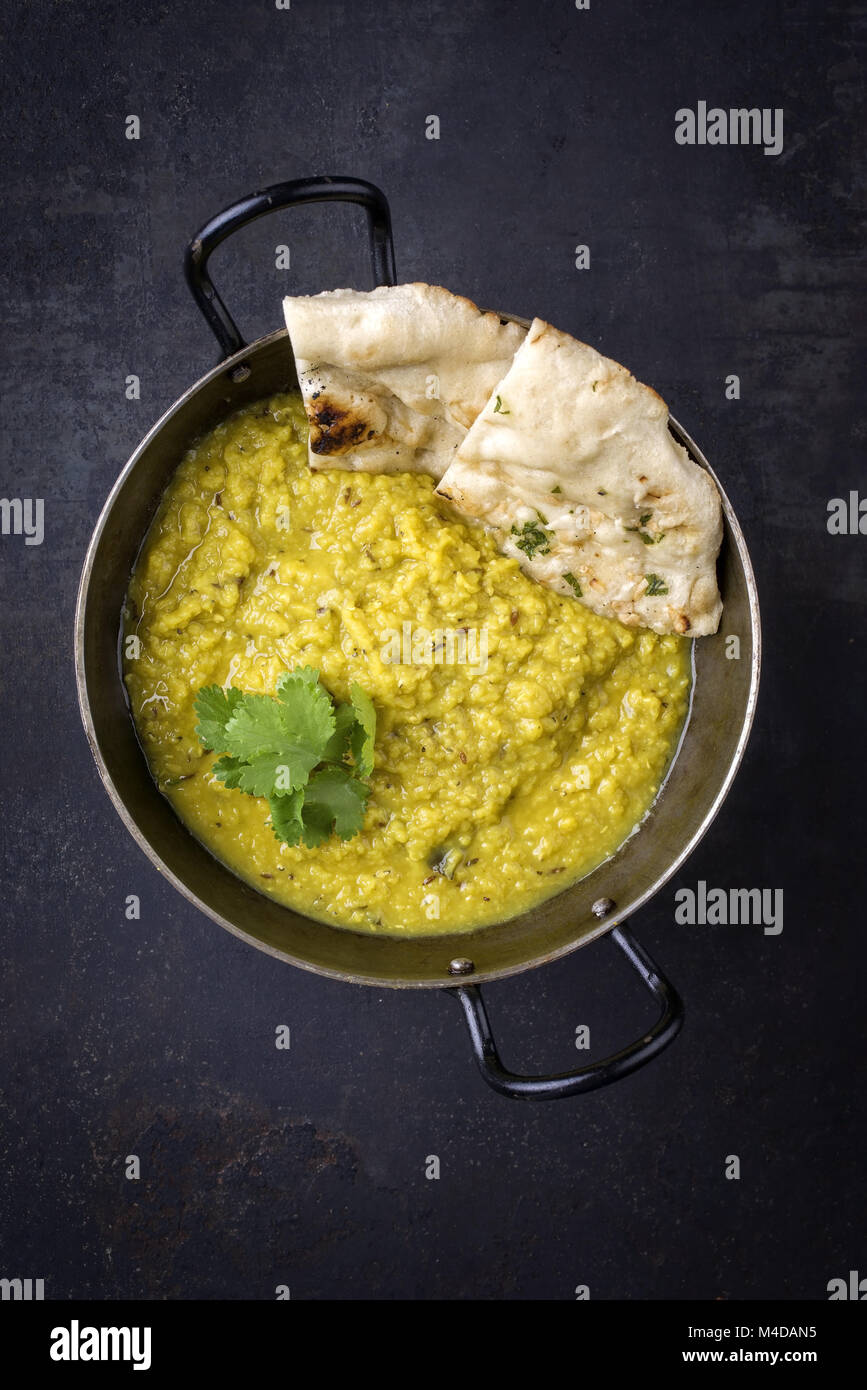 Indian Dal Soup with Naan Bread in Bowl Stock Photo - Alamy