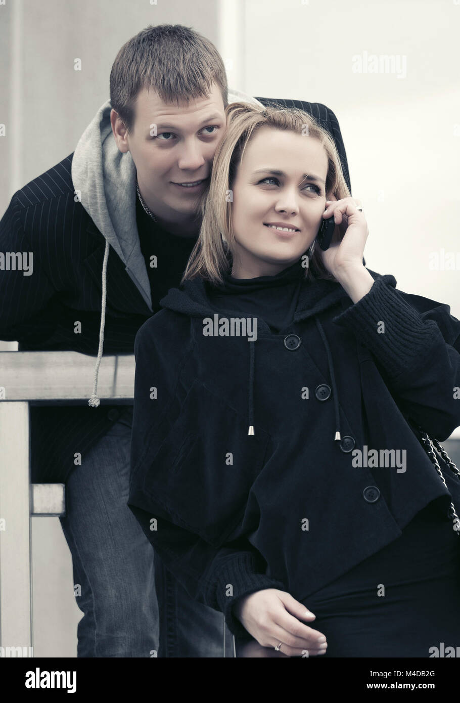 Woman man hoodie phone hi-res stock photography and images - Alamy