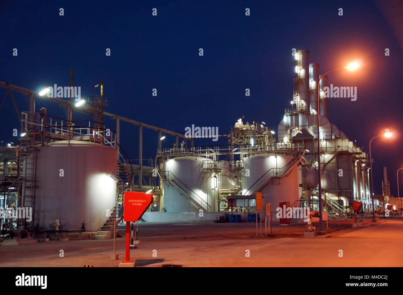 Oil and gas exploration and technology. Night view of a oil refinery ...