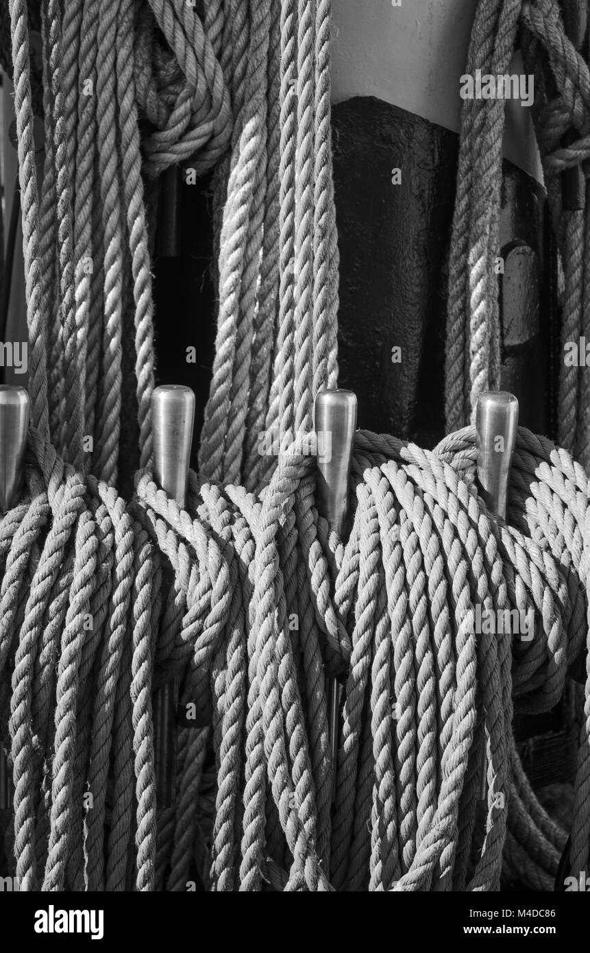 The ropes braided in bays on an ancient sailing vessel Stock Photo - Alamy