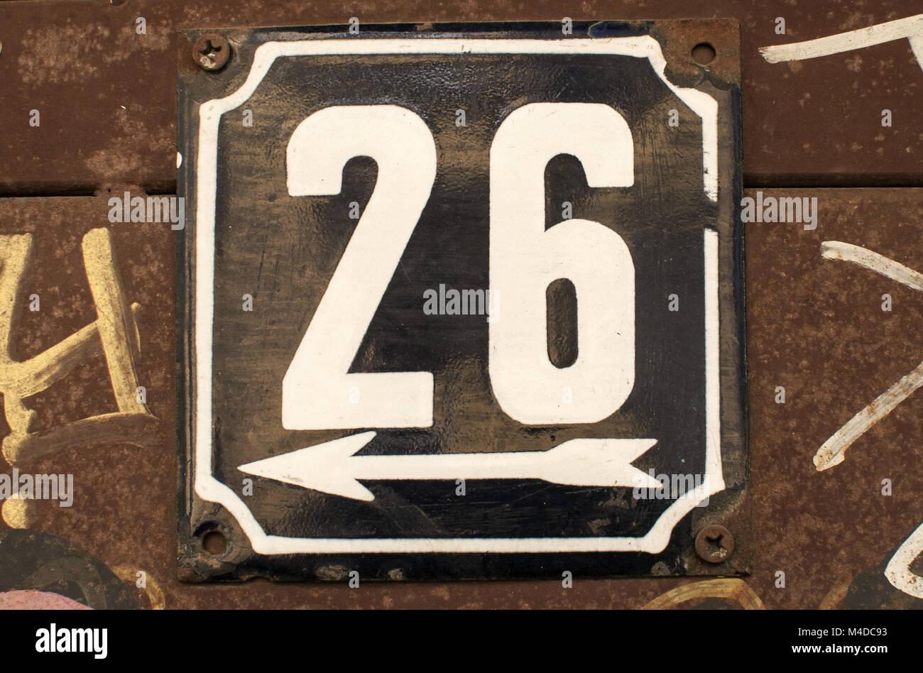 Weathered enameled plate number 26 Stock Photo - Alamy