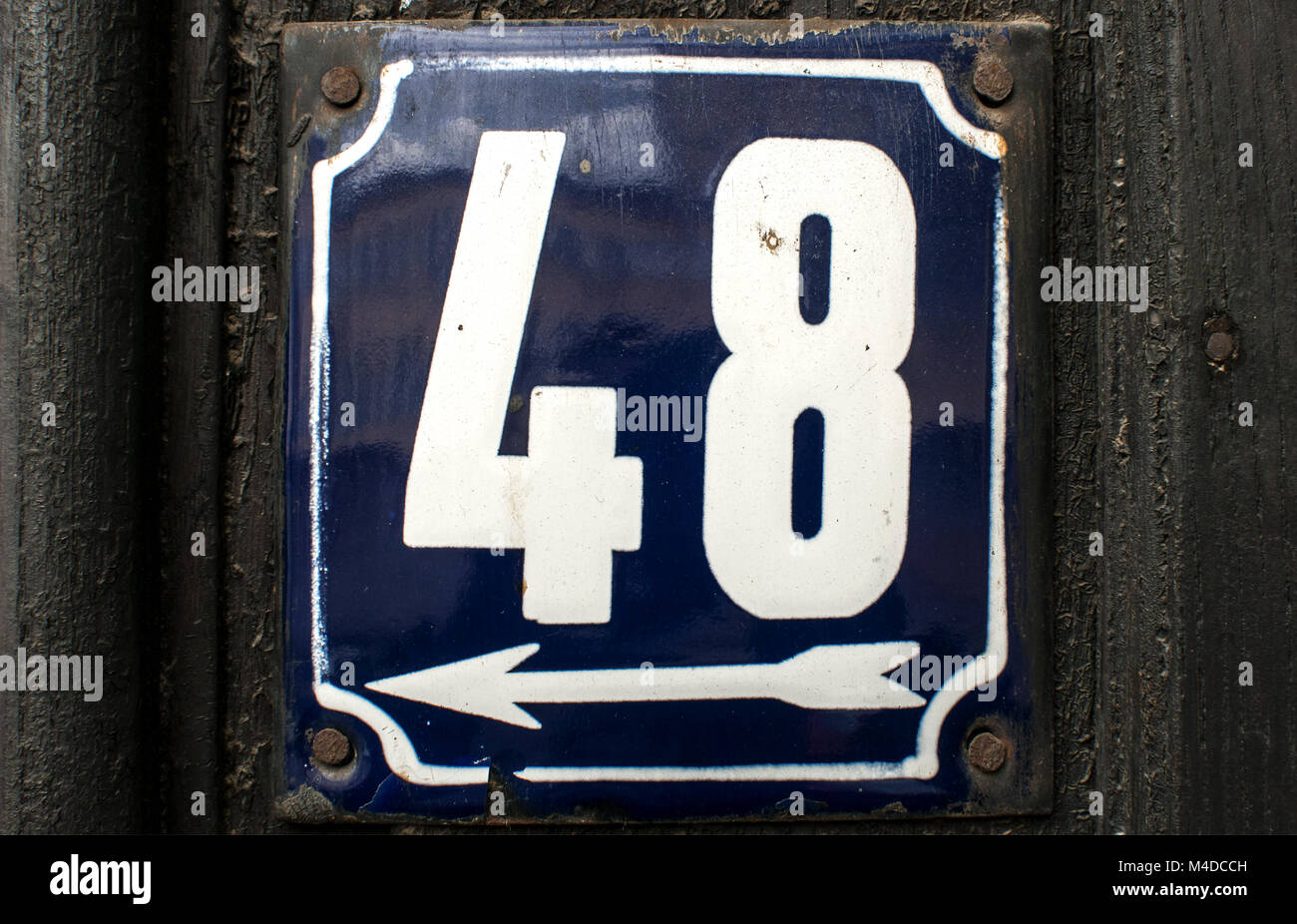 Weathered enameled plate number 48 Stock Photo - Alamy