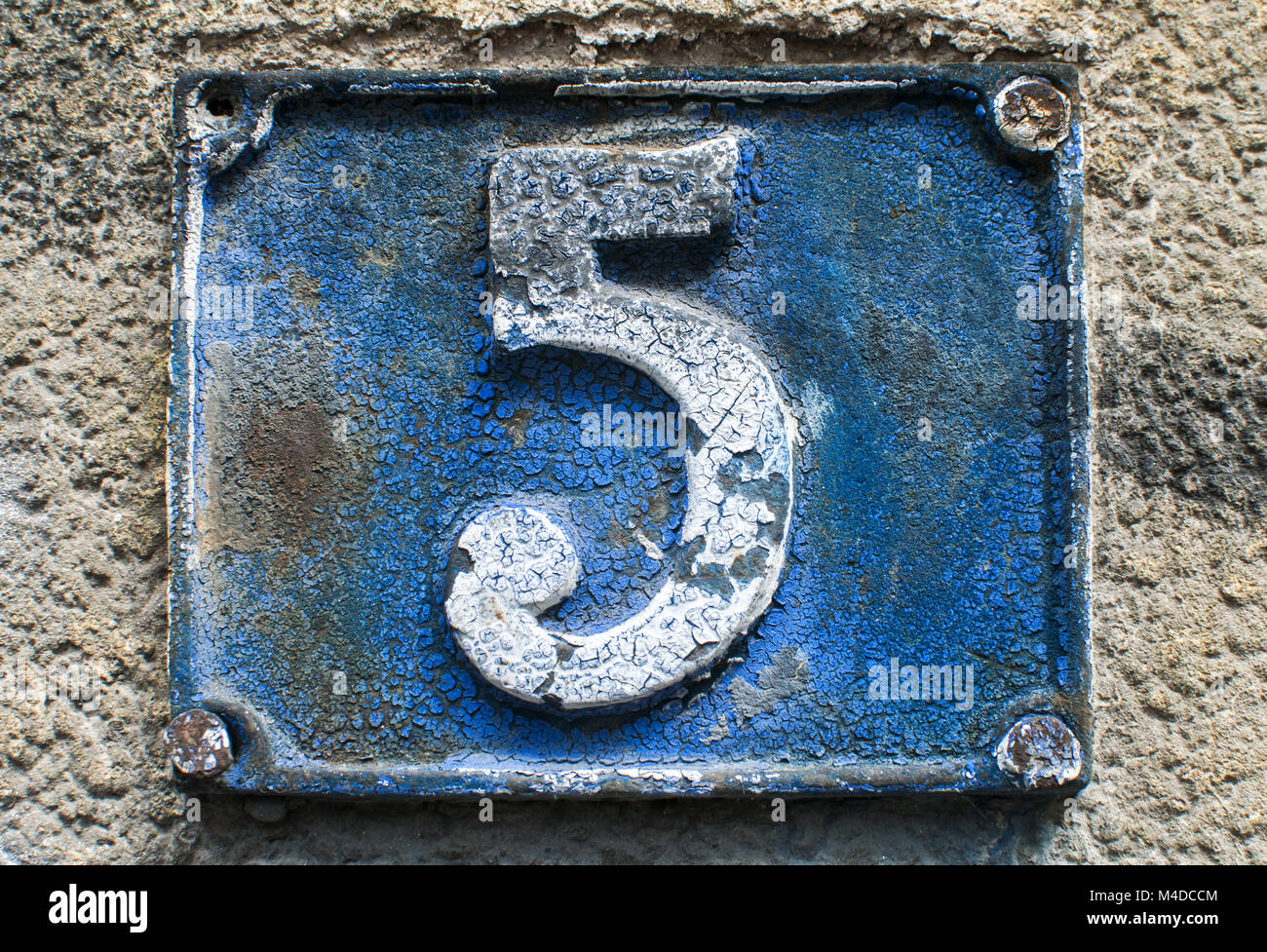Old retro cast iron plate number 5 Stock Photo - Alamy