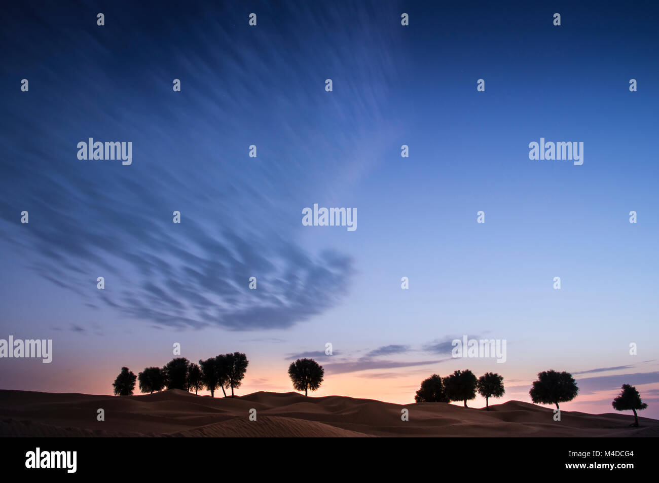 a calm and spectacular desert landscape at dusk Stock Photo - Alamy