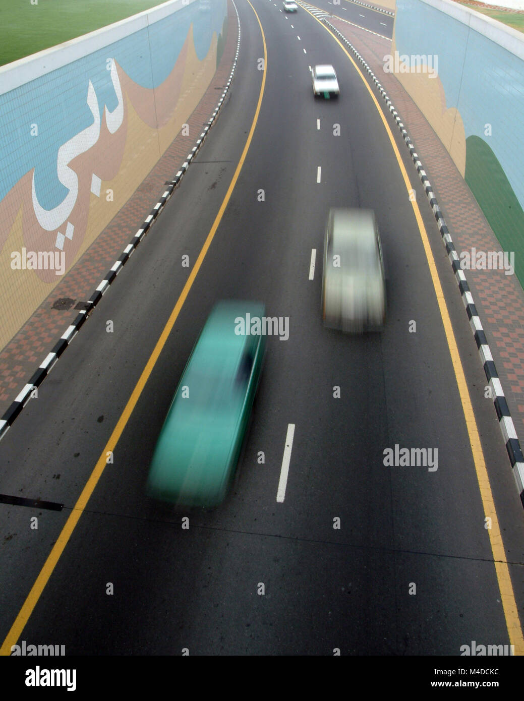 Underpass in Dubai with fast moving cars. Top view Stock Photo - Alamy