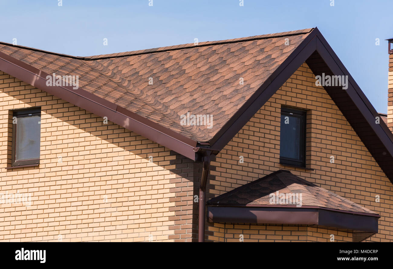 house with a gable roof window Stock Photo - Alamy