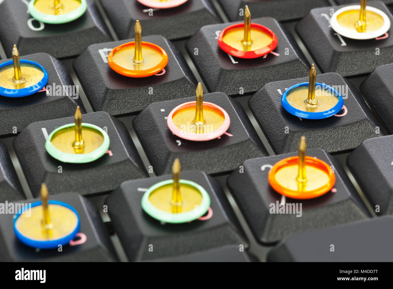 Pins on computer keyboard Stock Photo - Alamy