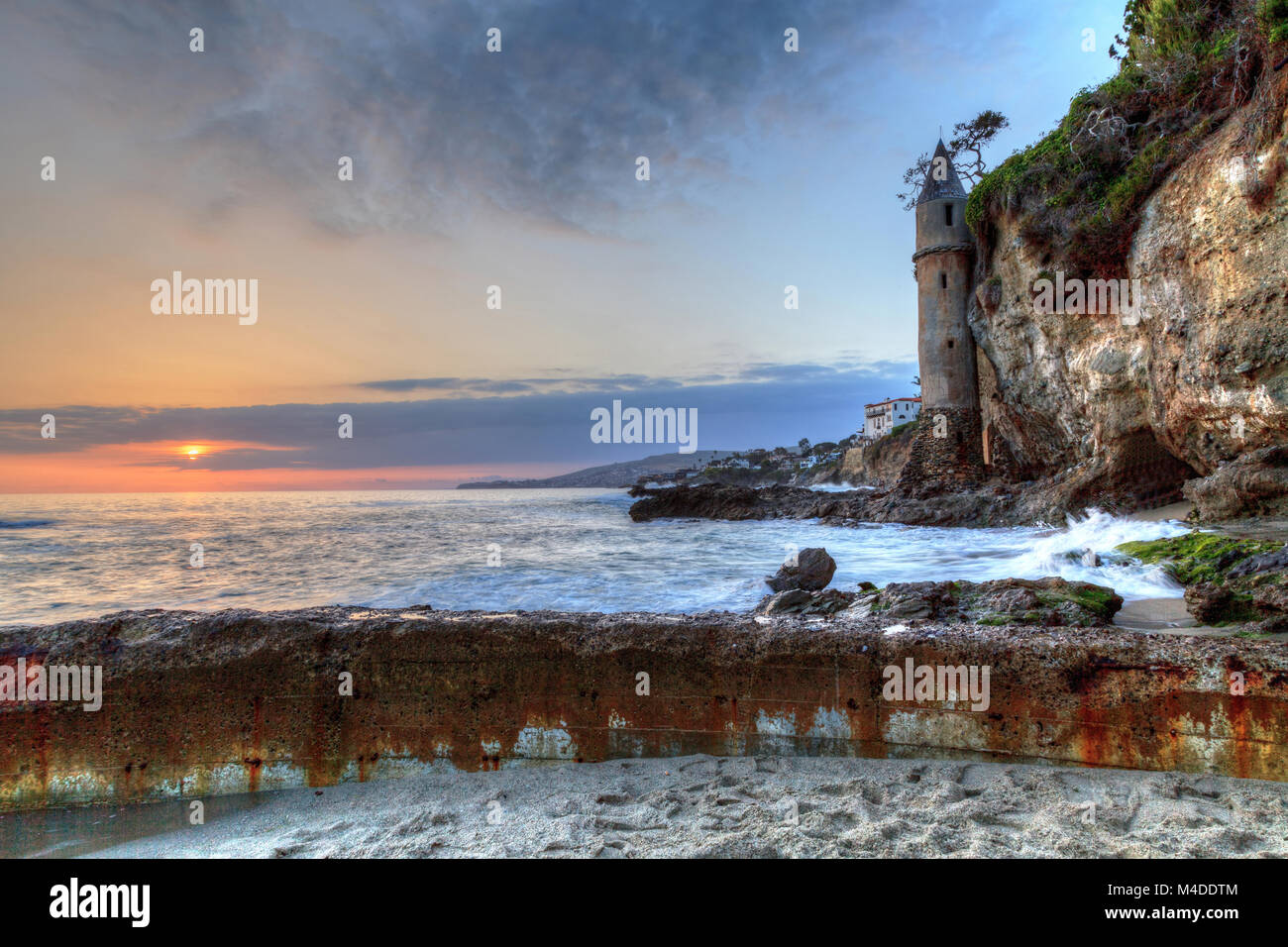 Sunset over Pirates tower at Victoria Beach in Laguna Beach Stock Photo ...
