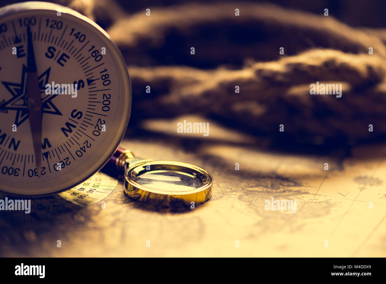 compass and magnifying glass Stock Photo - Alamy