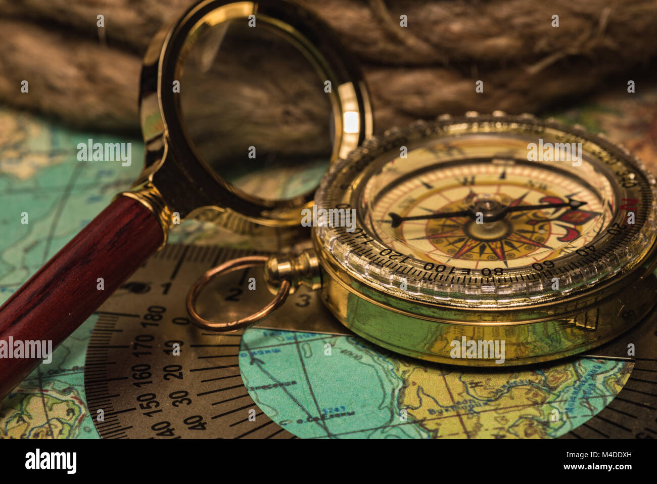 compass and magnifying glass Stock Photo - Alamy