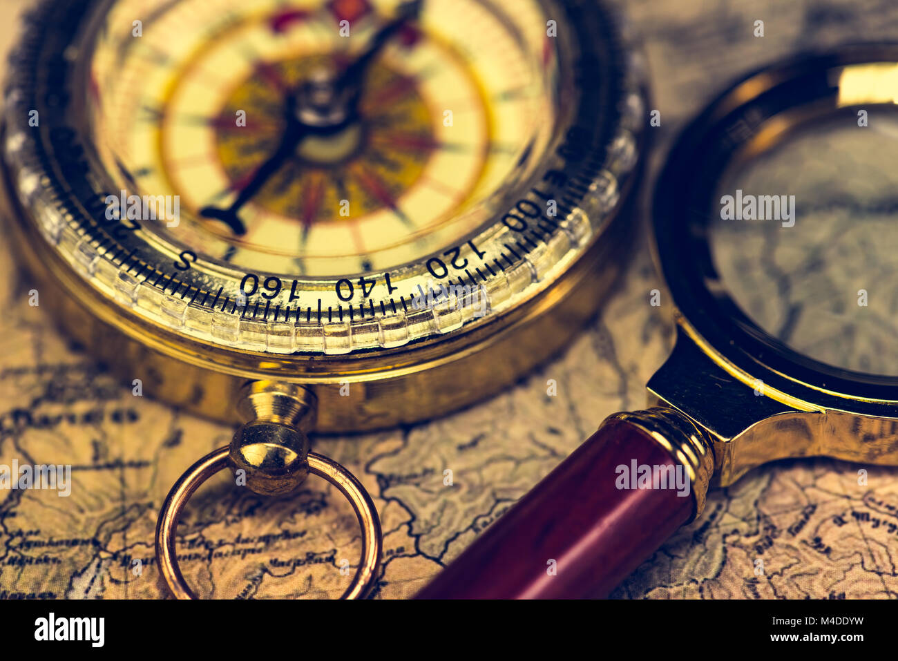 compass and magnifying glass Stock Photo - Alamy