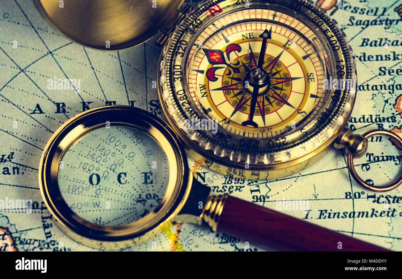 compass and magnifying glass Stock Photo - Alamy