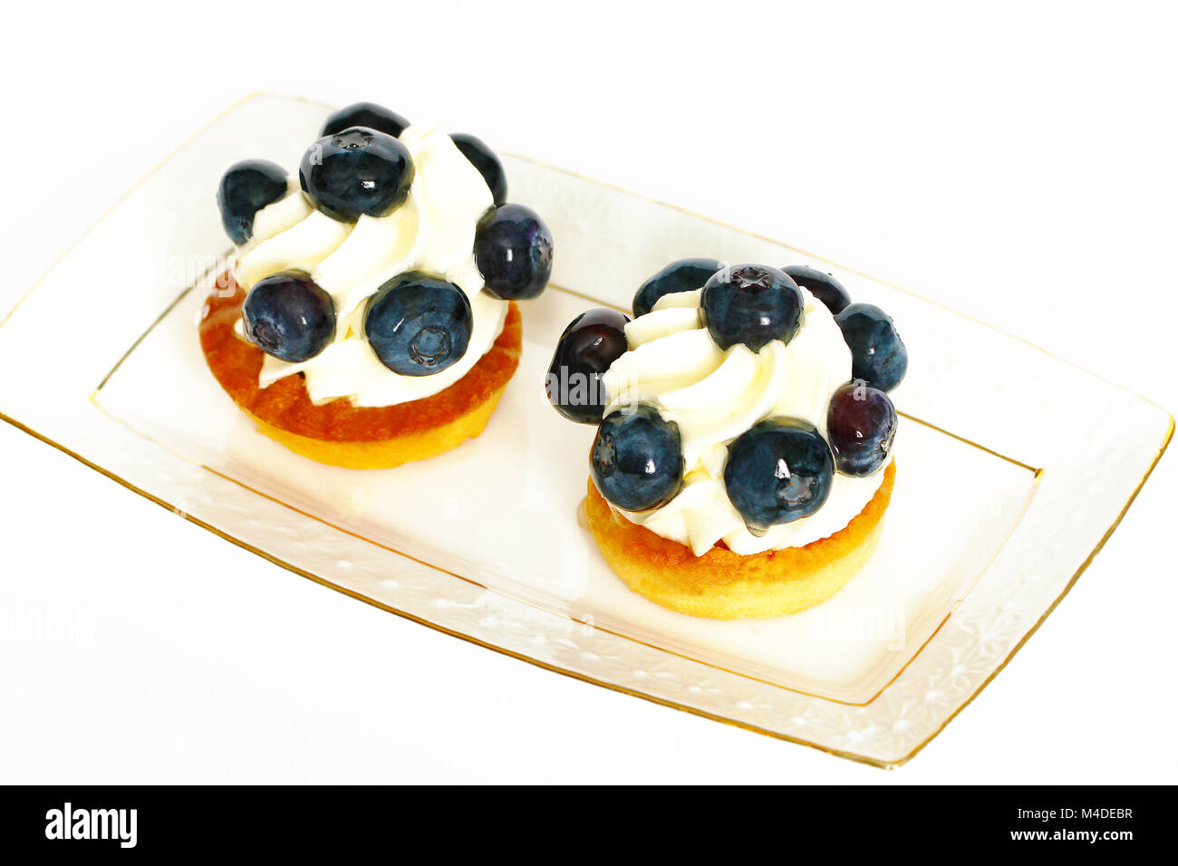 Beautiful small cake on white background Stock Photo - Alamy