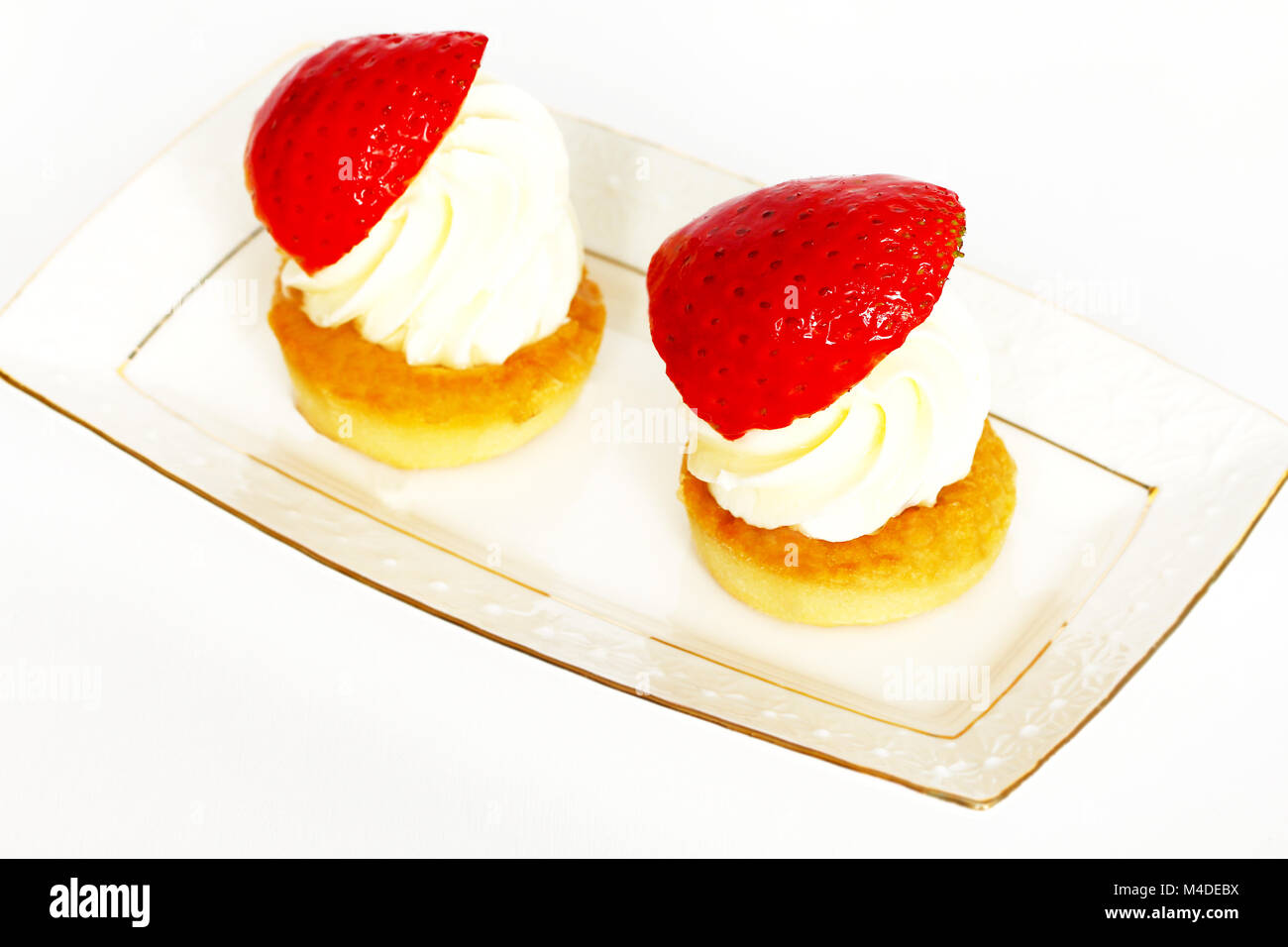 Beautiful small cake on white background Stock Photo - Alamy