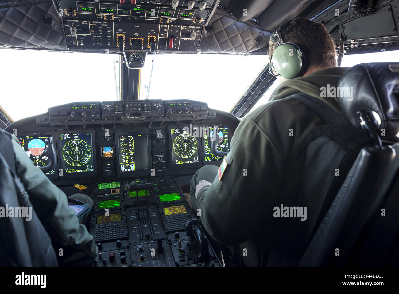 Military carrier airplane cockpit and pilots Stock Photo - Alamy