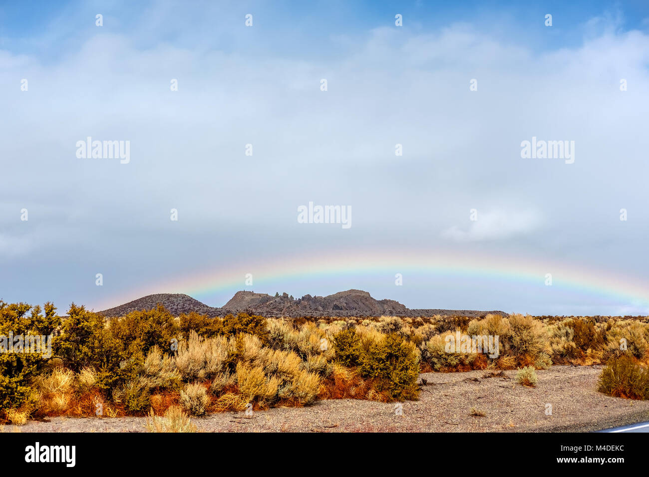 Rainbow in desert, California Stock Photo - Alamy