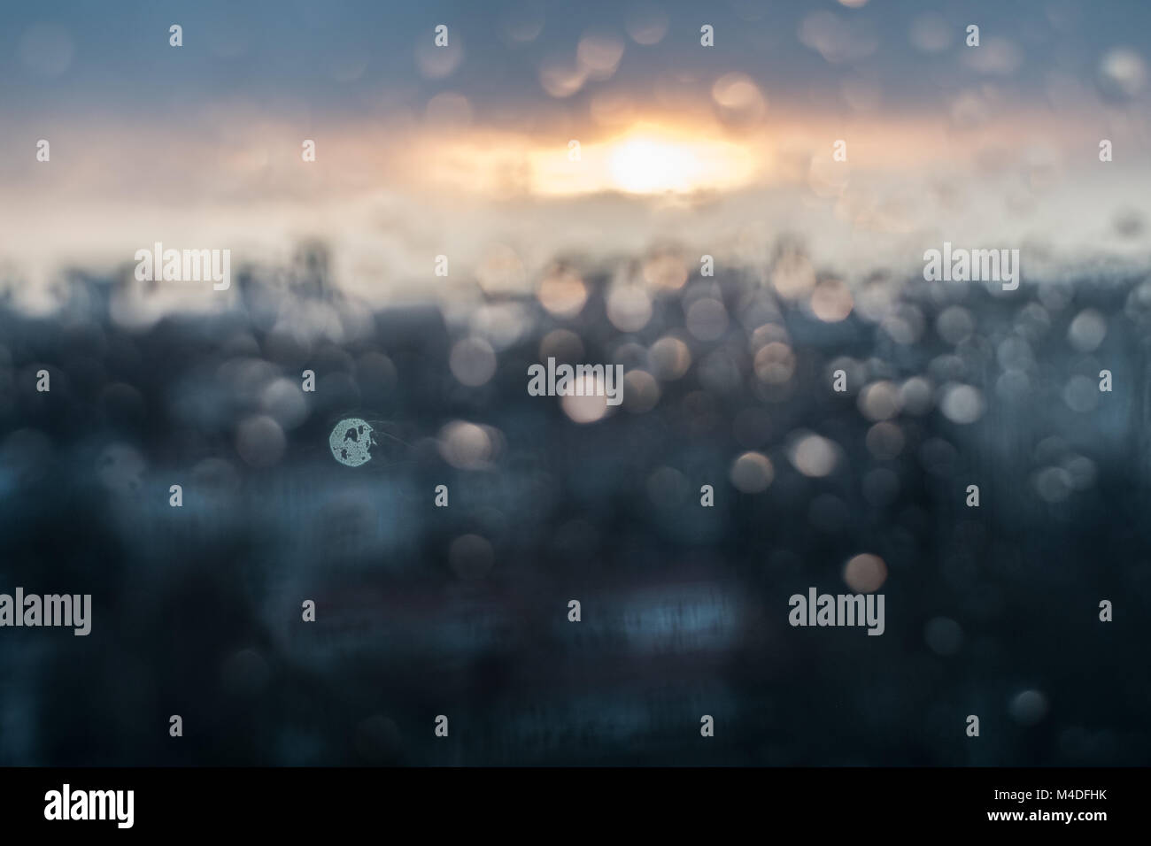 Unfocuced sun and water drops on the window Stock Photo - Alamy