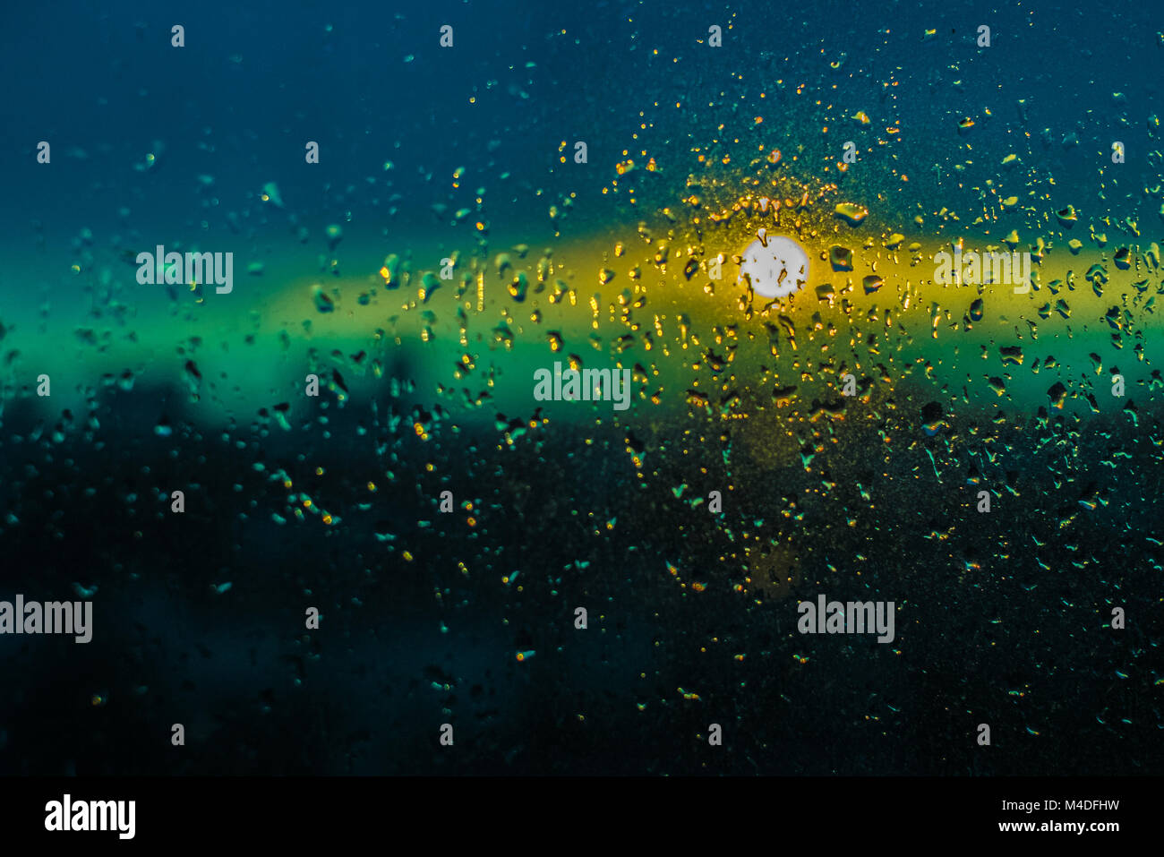 Unfocuced sun and water drops on the window Stock Photo - Alamy