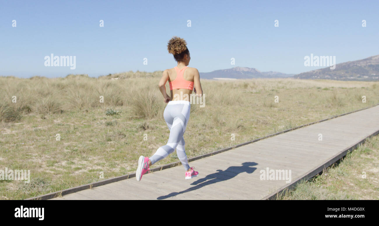Woman and running and back view hi-res stock photography and images - Alamy