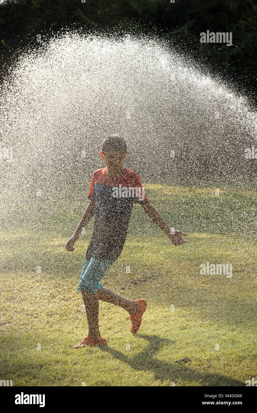 Play with water jets Stock Photo - Alamy