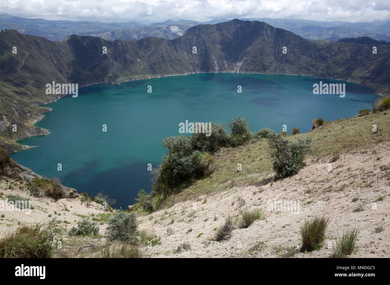 A view of Quilotoa Lake, an ancient volcano and starting point for the ...
