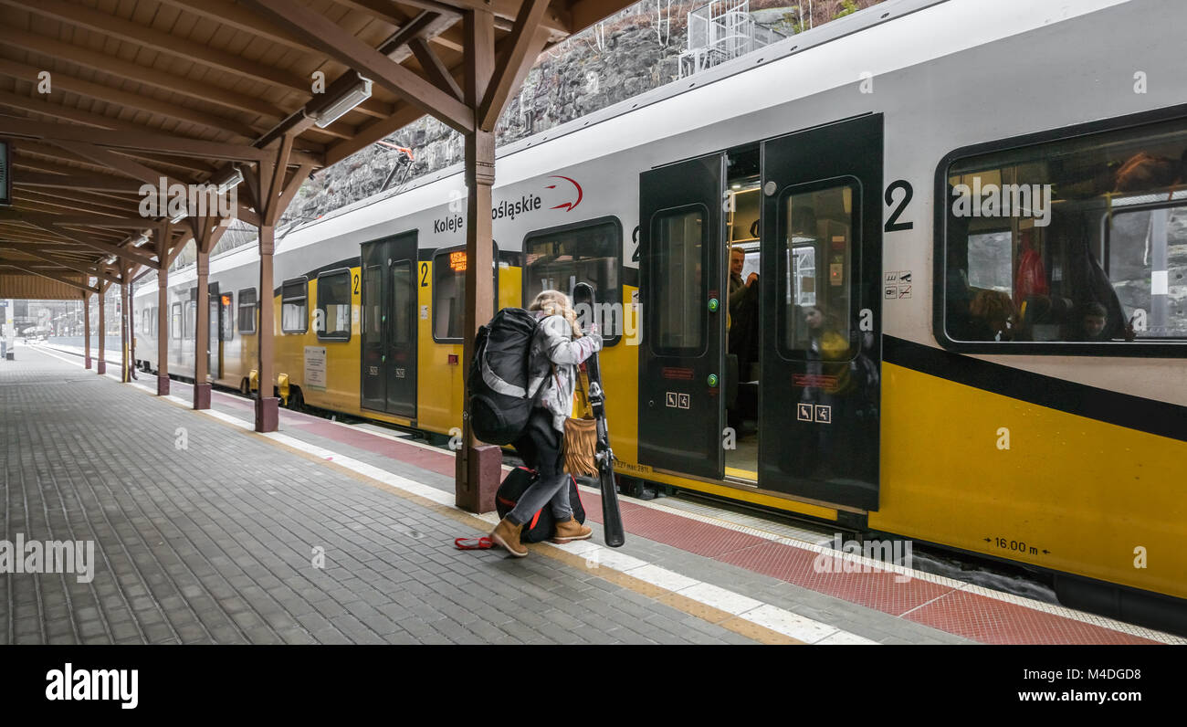 Woman boarding the train Stock Photo - Alamy