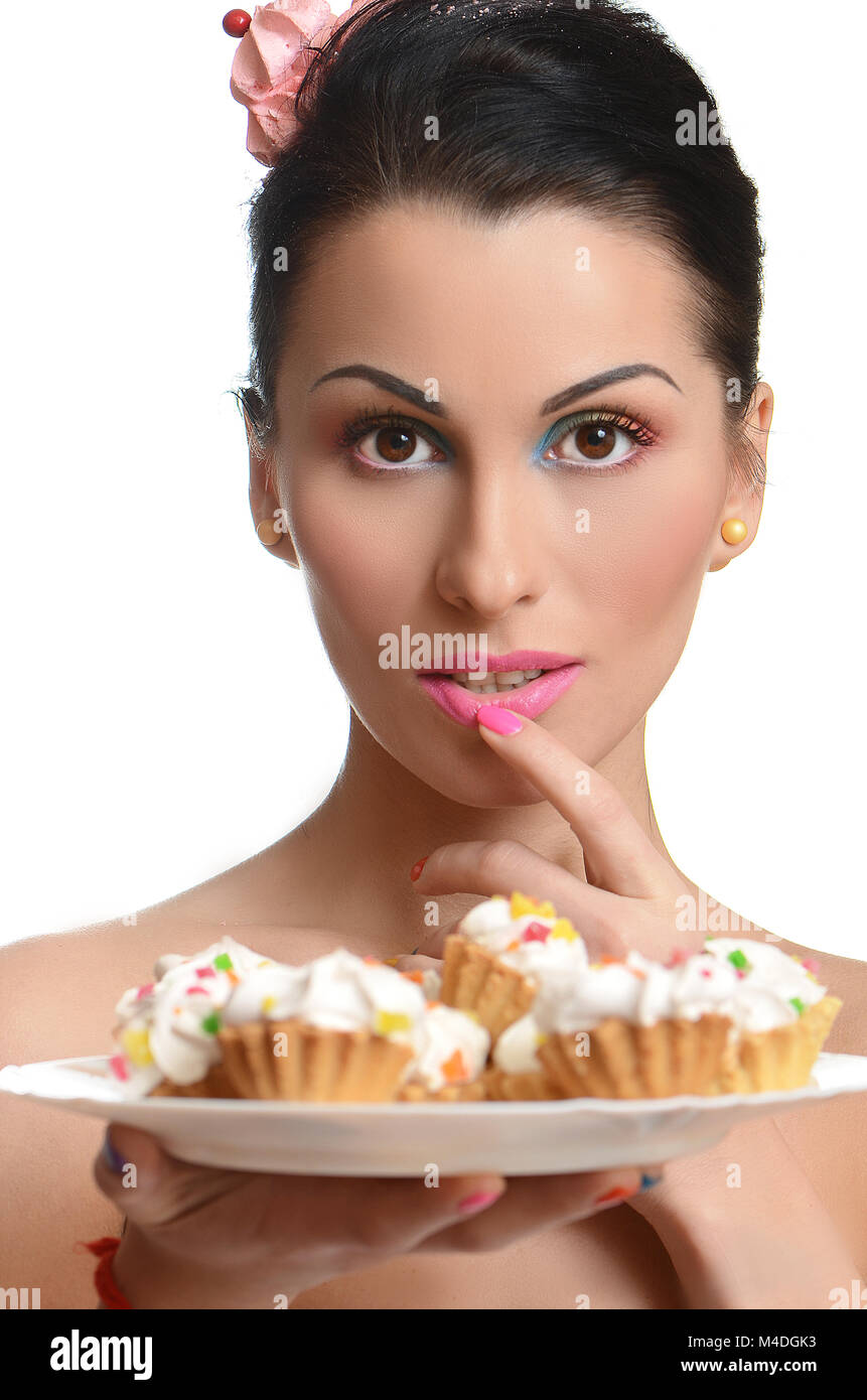 Beauty fashion model girl taking colorful cakes Stock Photo - Alamy