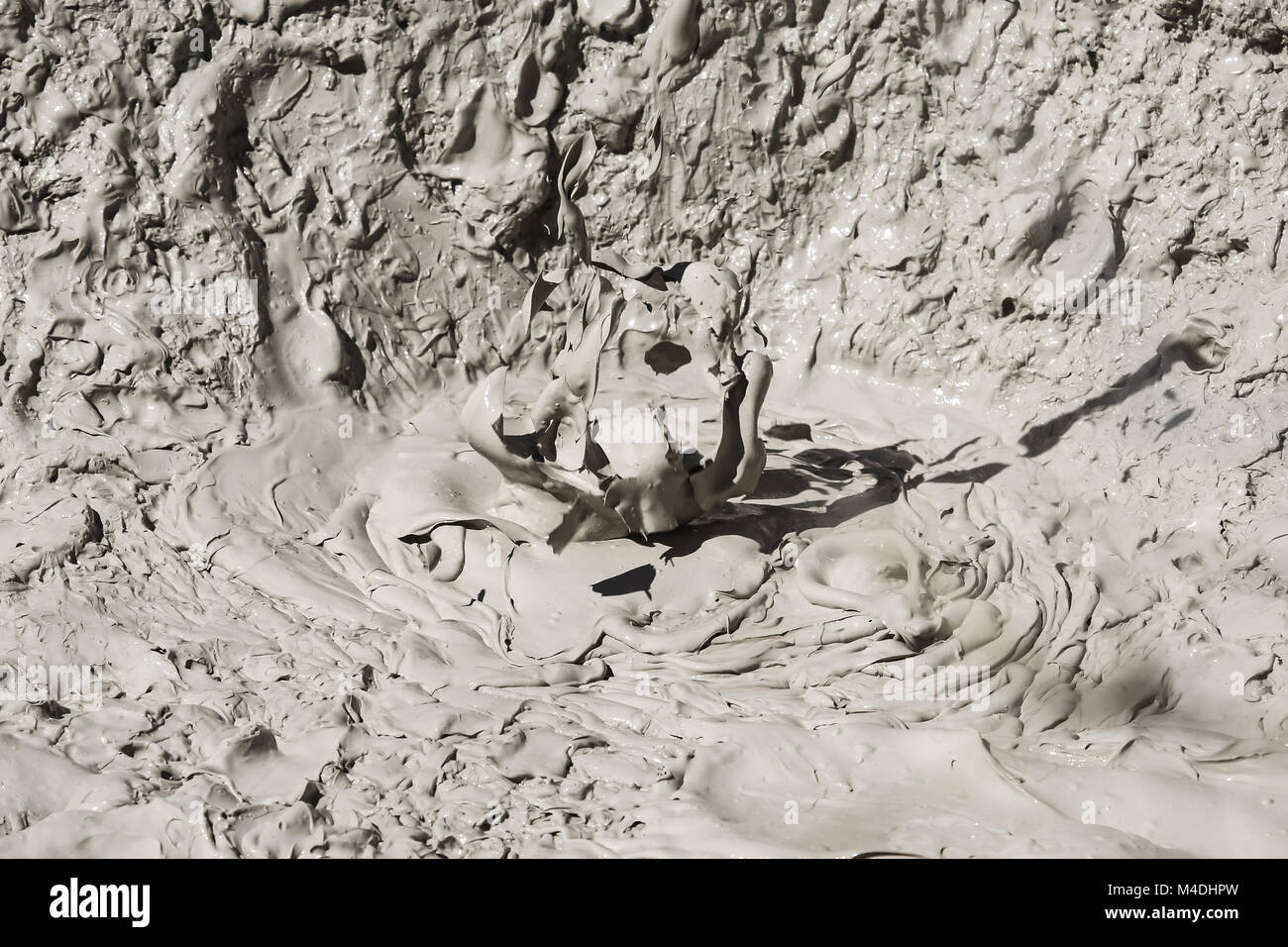 Bubbling mudhole in volcanic area Stock Photo - Alamy