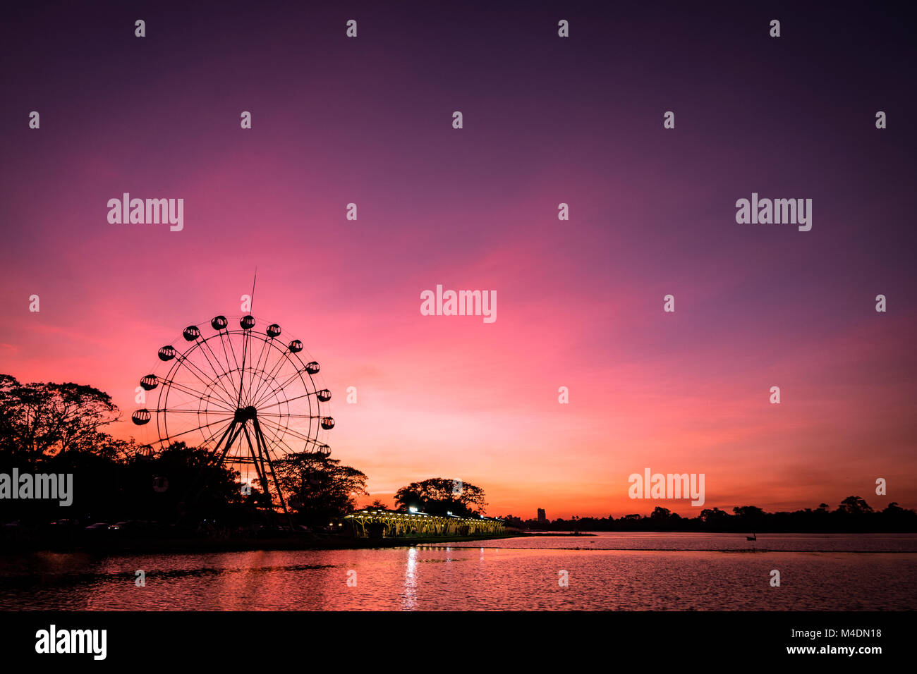 Ferris wheel silhouetted at sunset on Inya Lake in Yangon Myanmar Stock ...